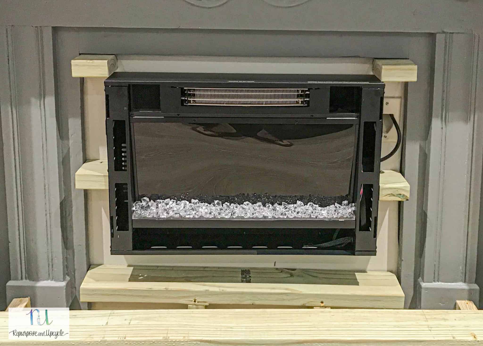 Our New DIY Raised Electric Fireplace Hearth with Stone