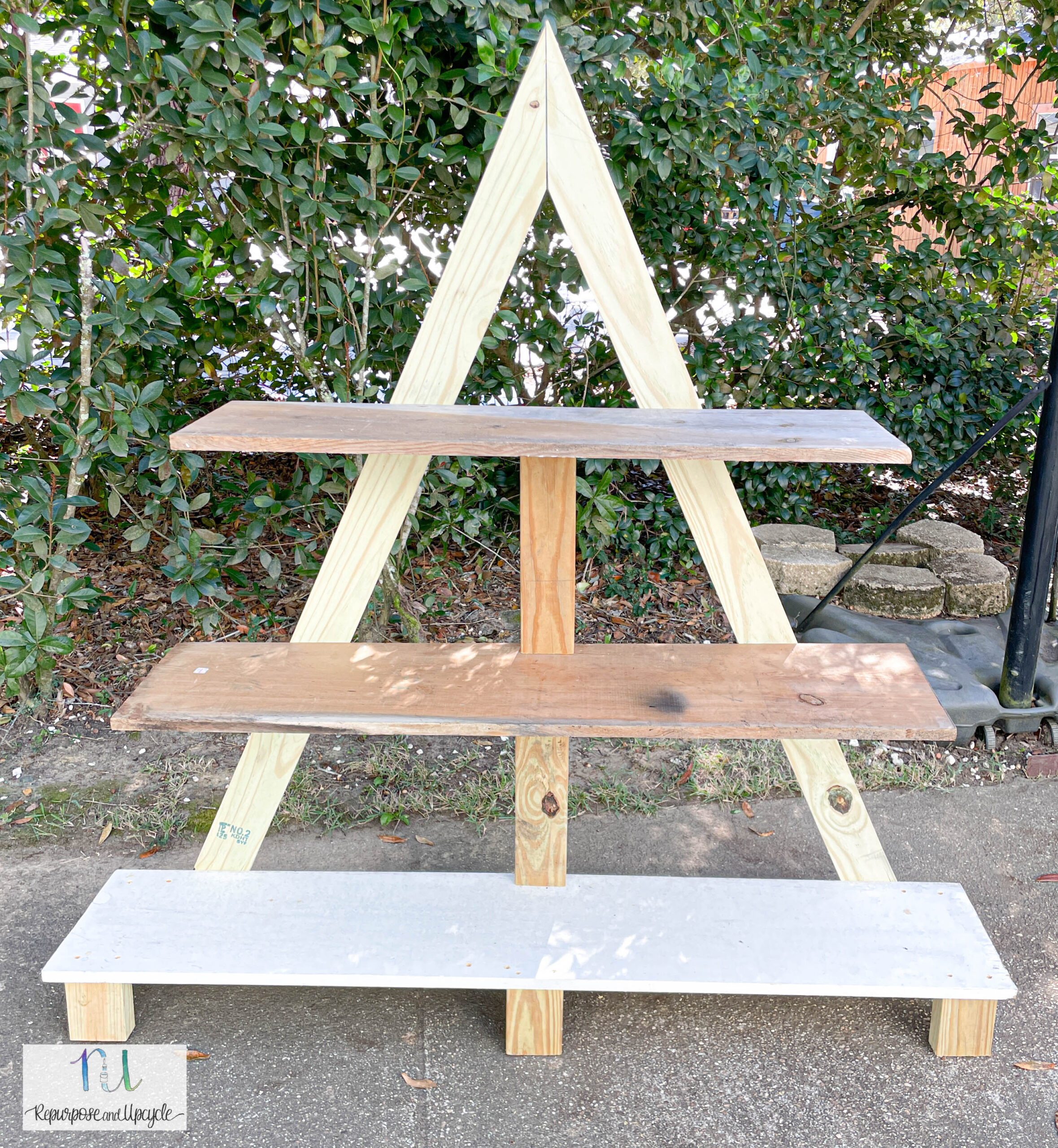 Christmas Village Display Idea with a Christmas tree shaped Shelf