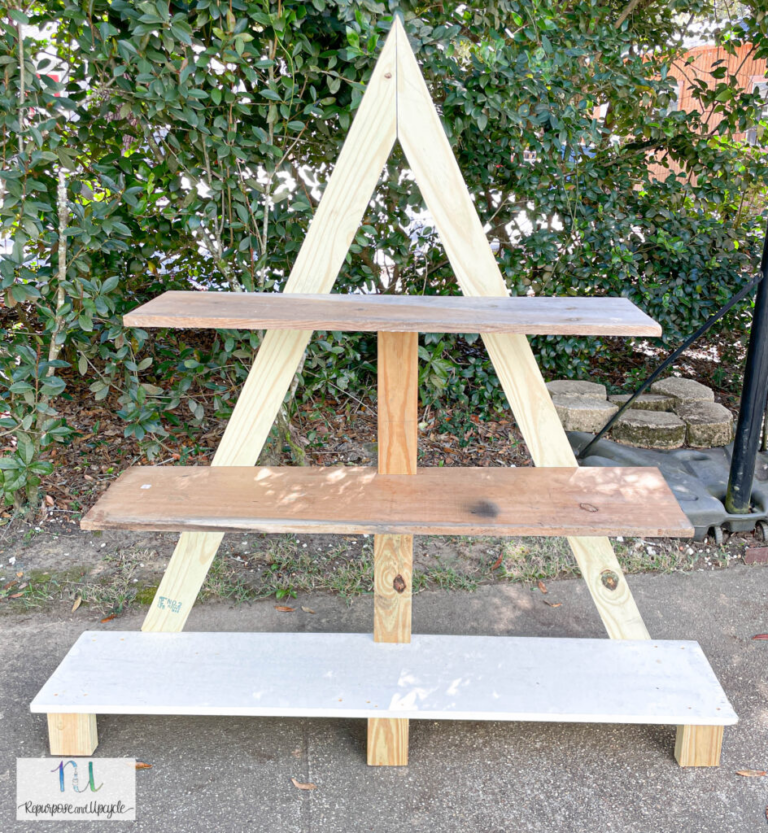 Christmas Village Display Idea with a Christmas tree shaped Shelf