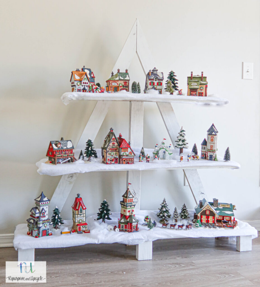 Christmas Village Display Idea with a Christmas tree shaped Shelf